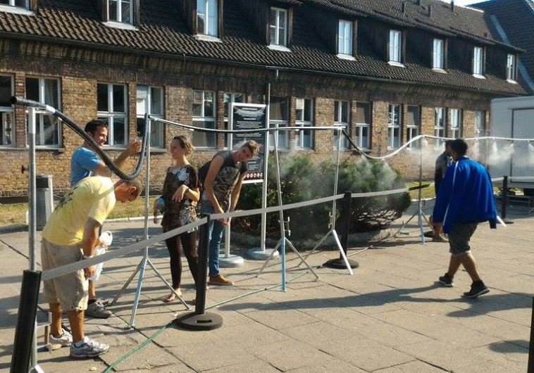 Showers installed outside Auschwitz remind visitors of gas chambers ...